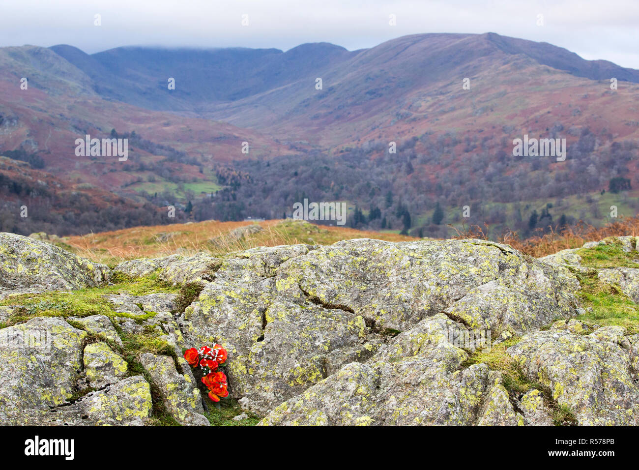 Plastic flower cross on Todd Crag in the Lake District. Not an ...