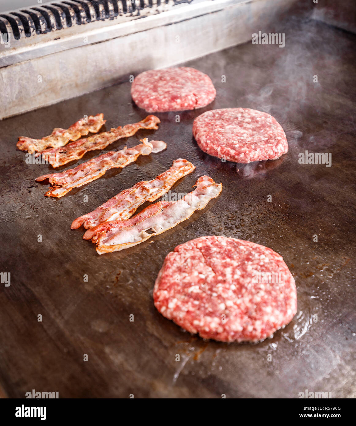 Fresh meat and bacon cooked Stock Photo - Alamy