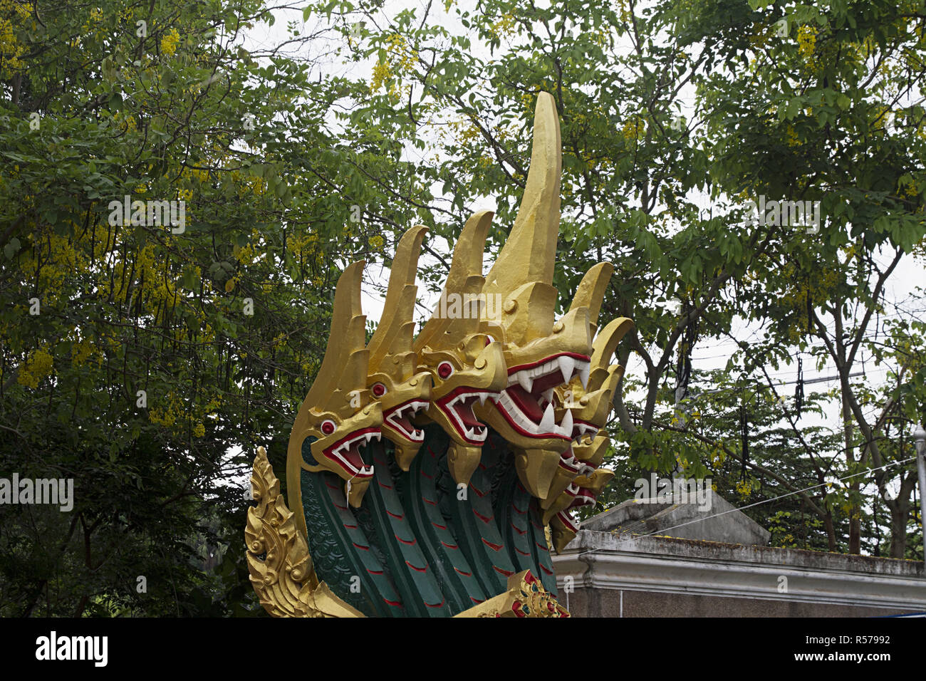 many heads snake buddha traditional green golden color Stock Photo - Alamy