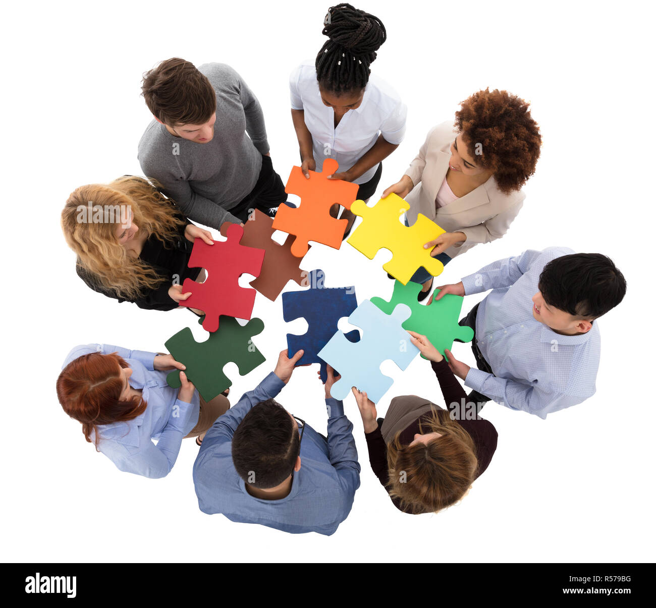 Group Of College Students Solving Puzzle Stock Photo - Alamy