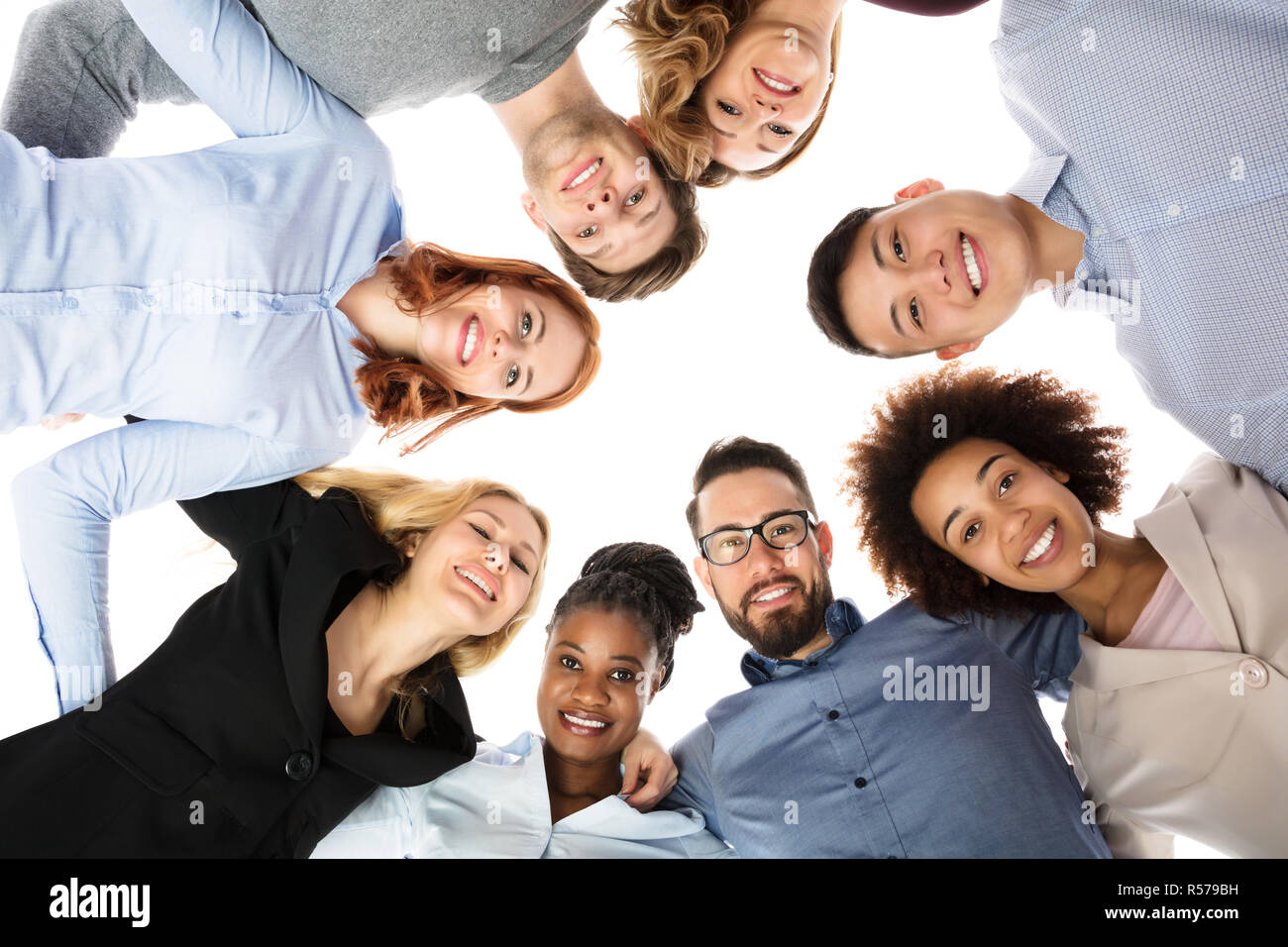 Group Of College Students Forming Huddle Stock Photo - Alamy