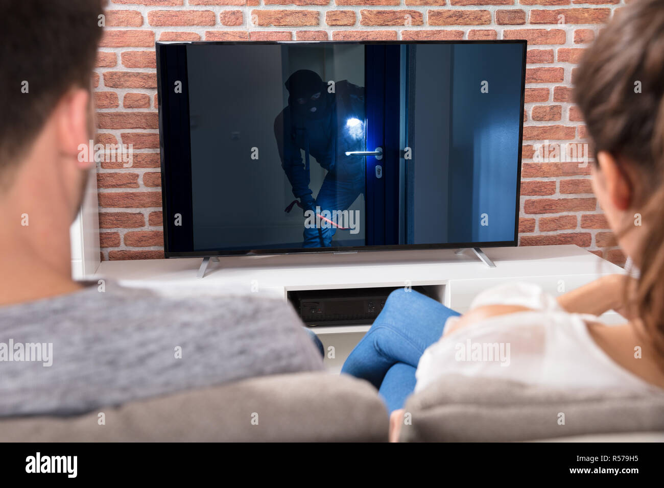 Woman looking wall display watching hi-res stock photography and images ...