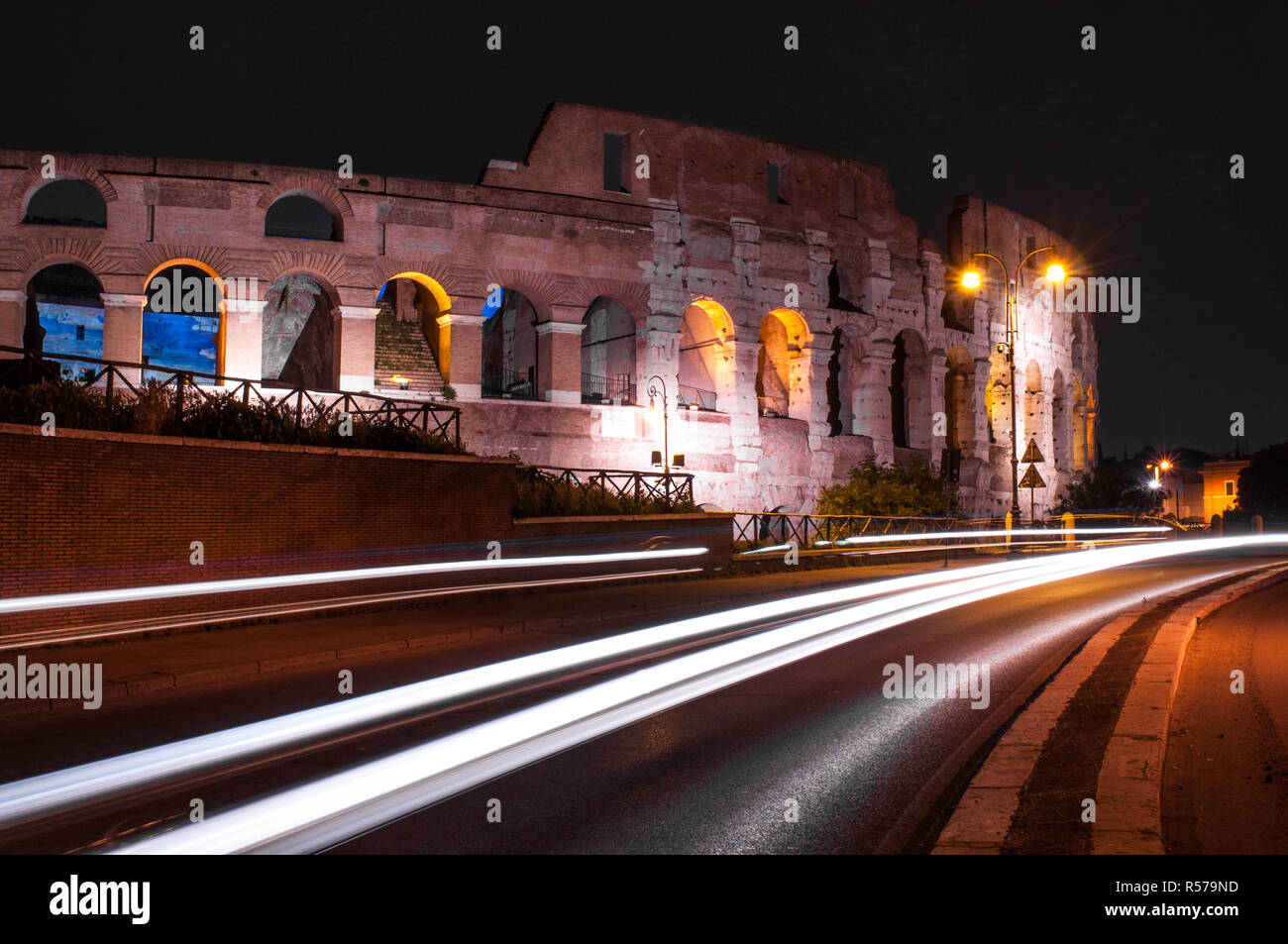 Colosseum or Coliseum at night with light trail, Rome Stock Photo - Alamy