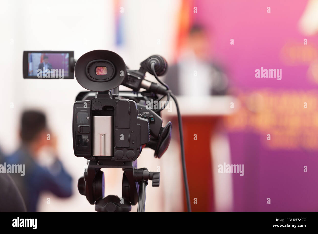 Filming an media event with a video camera Stock Photo - Alamy