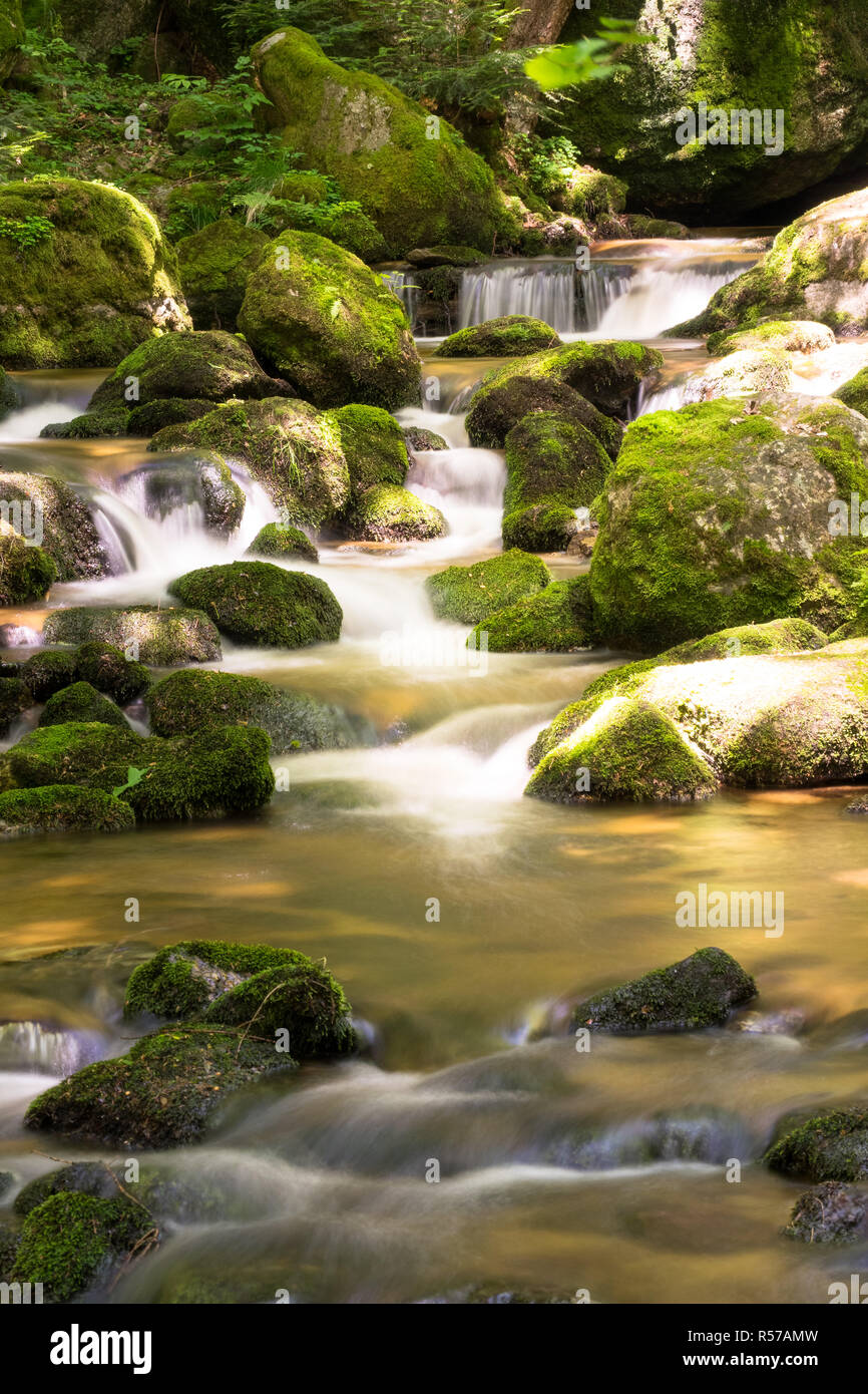 mountain stream with waterfall Stock Photo - Alamy