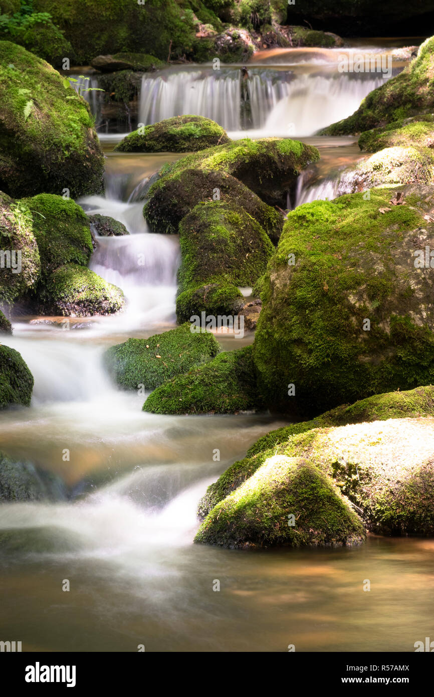 mountain stream with waterfall Stock Photo - Alamy
