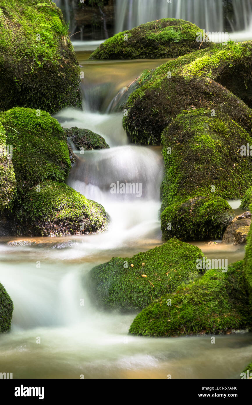 mountain stream with waterfall Stock Photo - Alamy