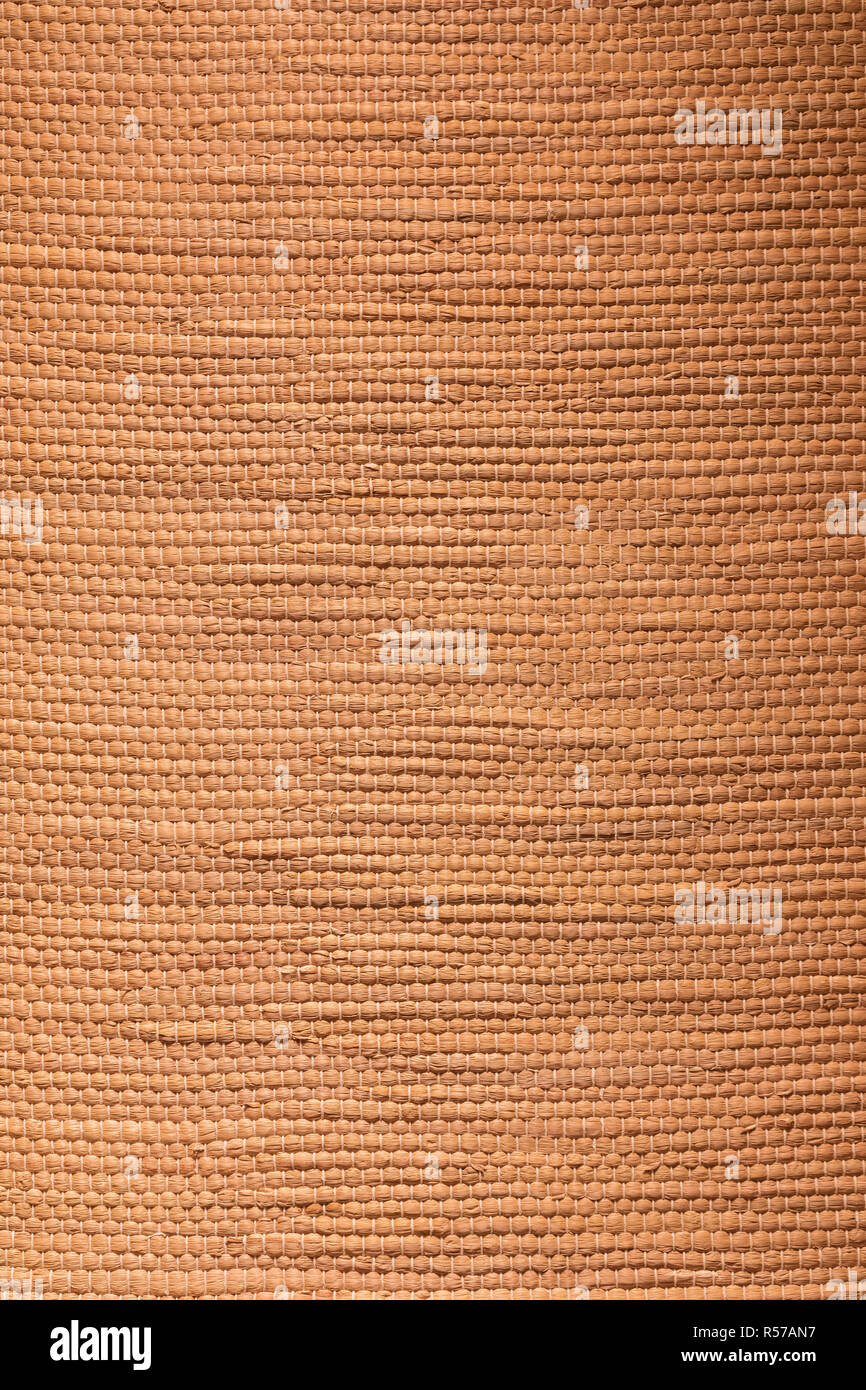 Tan textured bamboo fabric background tied together in knots Stock ...