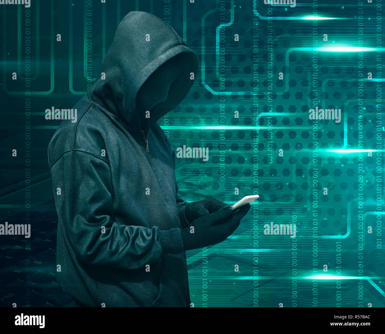 Hacker with mask touching a smartphone screen Stock Photo - Alamy