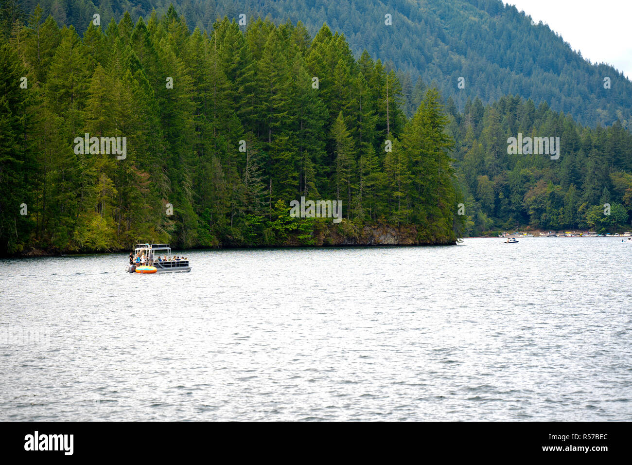 Picturesque mountain clear water deep Merwin Lake with evergreen ...