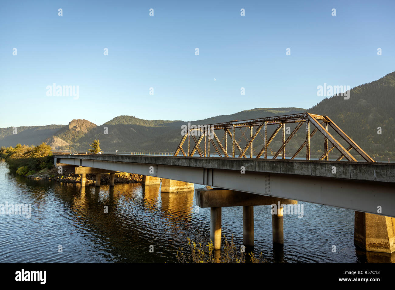 A transport and railway bridge over the Columbia River is built side by ...