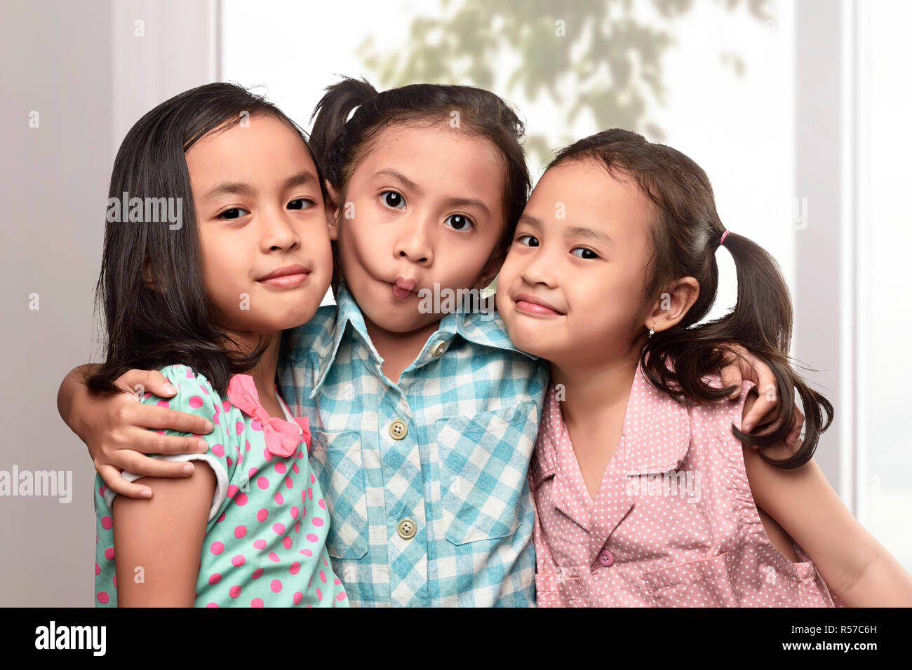 Image of funny asian kids playing on the living room Stock Photo - Alamy