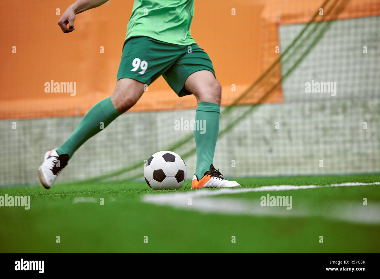 The legs of soccer football player Stock Photo - Alamy