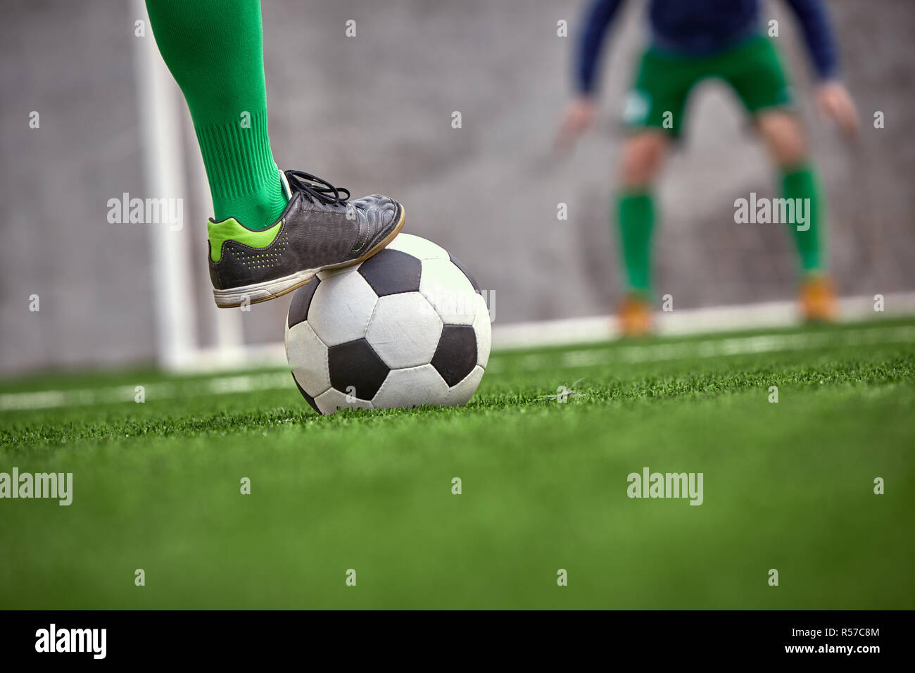 The leg of soccer football player Stock Photo - Alamy