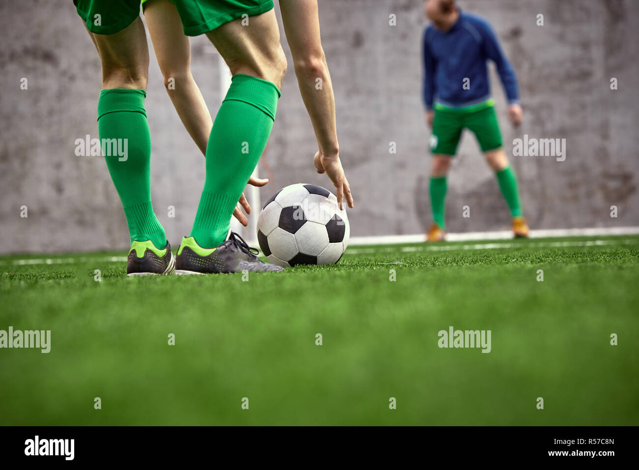 The legs of soccer football player Stock Photo - Alamy
