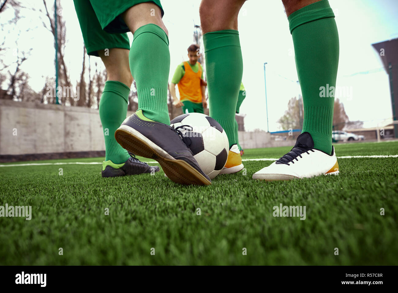 The legs of soccer football player Stock Photo - Alamy