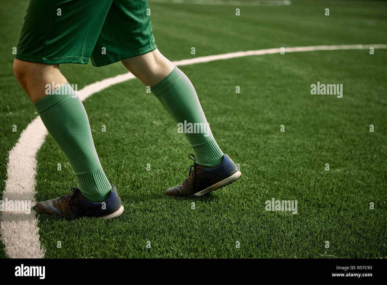 The legs of soccer football player Stock Photo - Alamy