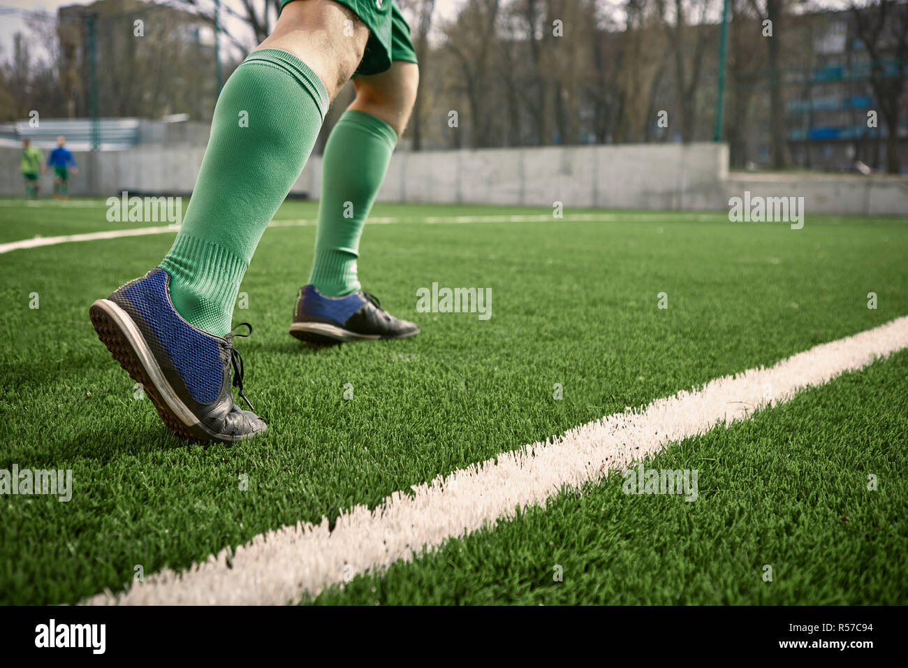 The legs of soccer football player Stock Photo - Alamy