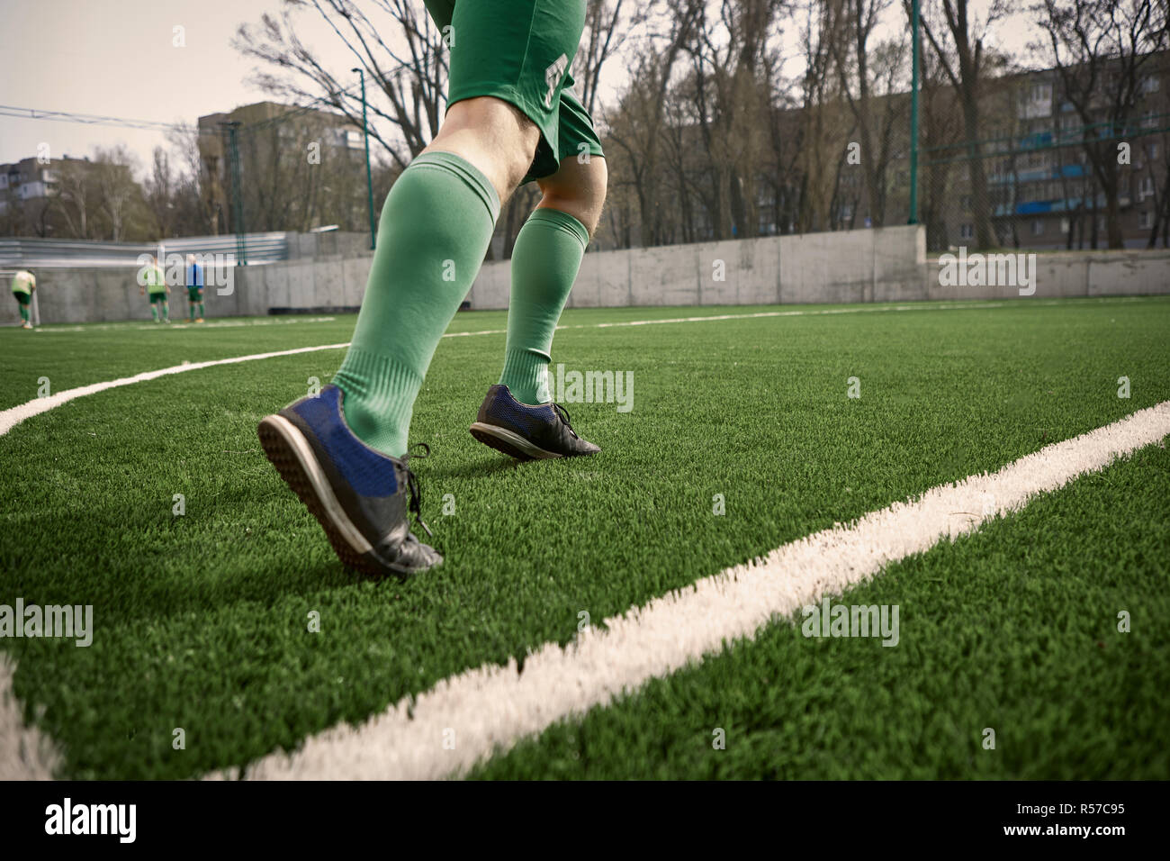 The legs of soccer football player Stock Photo - Alamy