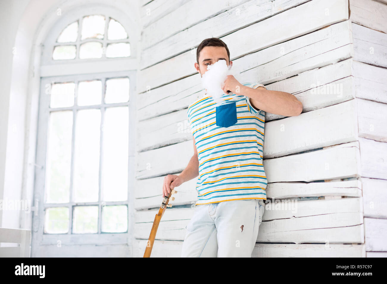 The face of vaping young man Stock Photo - Alamy