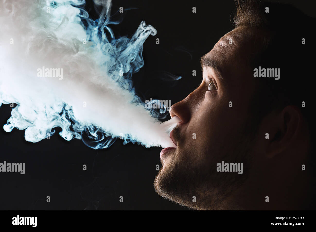 The face of vaping young man Stock Photo - Alamy