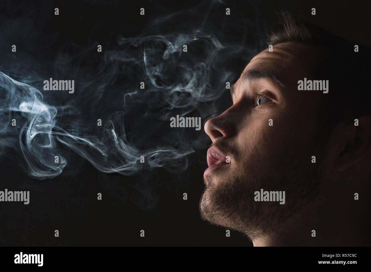 The face of vaping young man Stock Photo - Alamy
