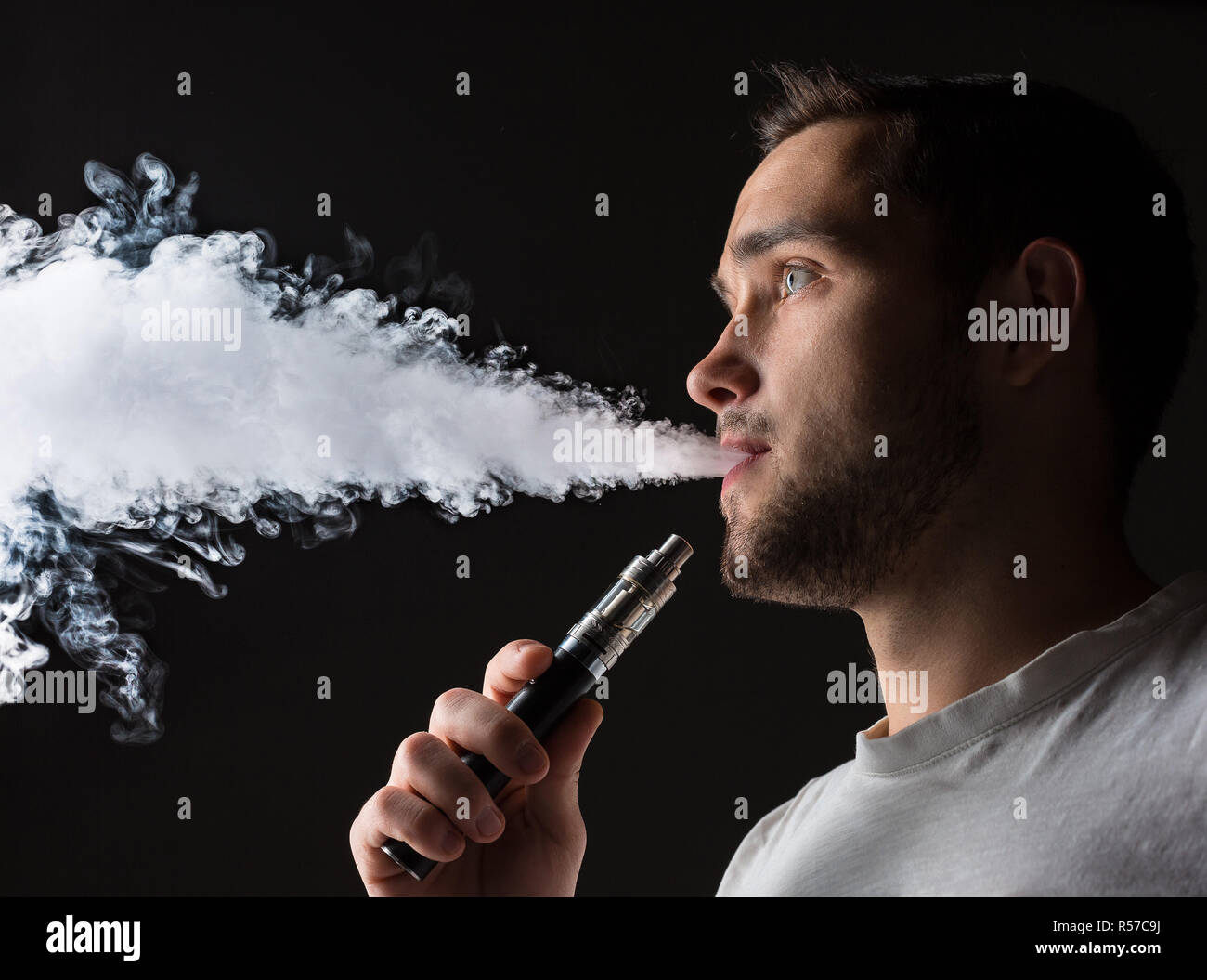 The face of vaping young man Stock Photo - Alamy