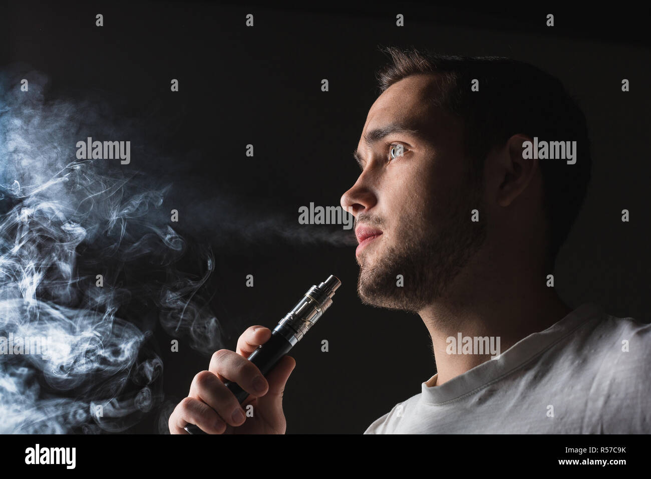 The face of vaping young man Stock Photo - Alamy