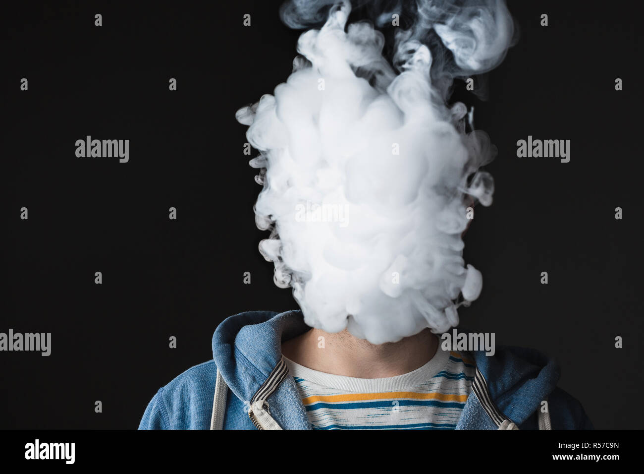 The face of vaping young man Stock Photo - Alamy