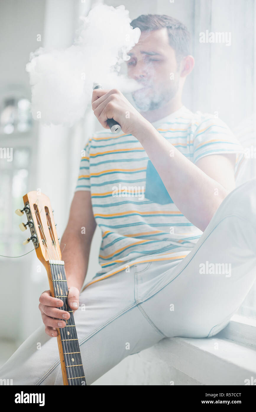 The face of vaping young man Stock Photo - Alamy