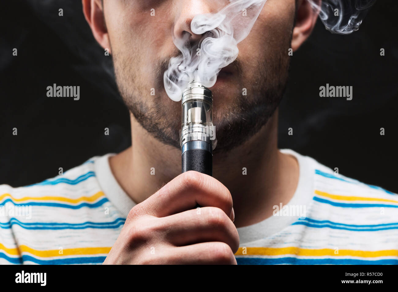 The face of vaping young man Stock Photo - Alamy