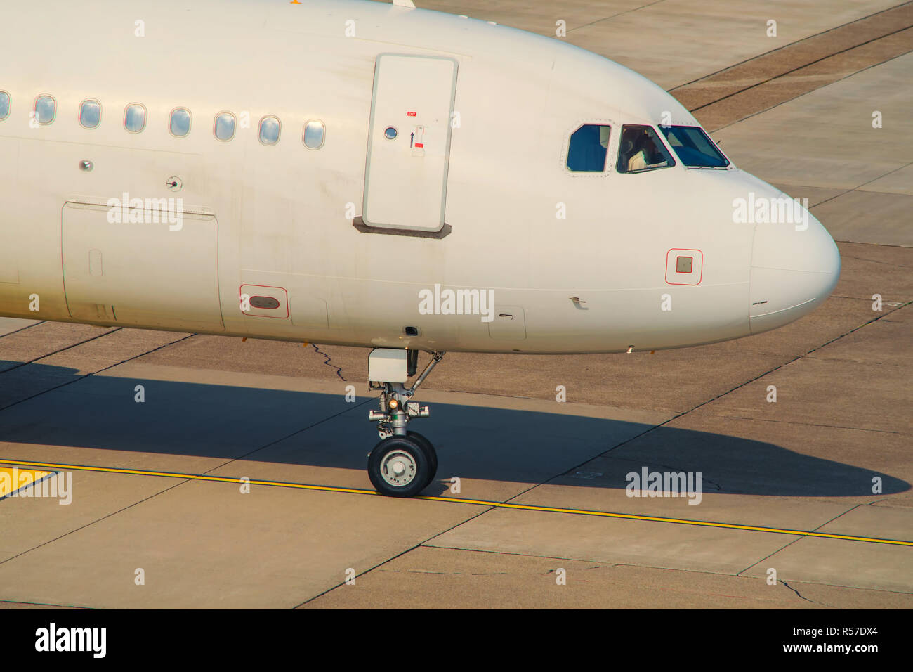 passenger plane on the runway passenger plane on the rolling field ...