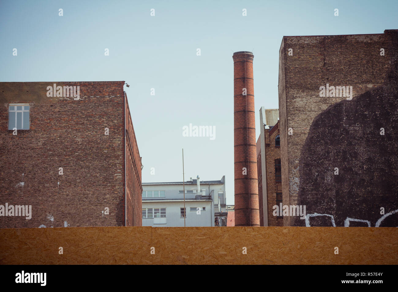 Old factory building with industrial brick chimney Stock Photo - Alamy