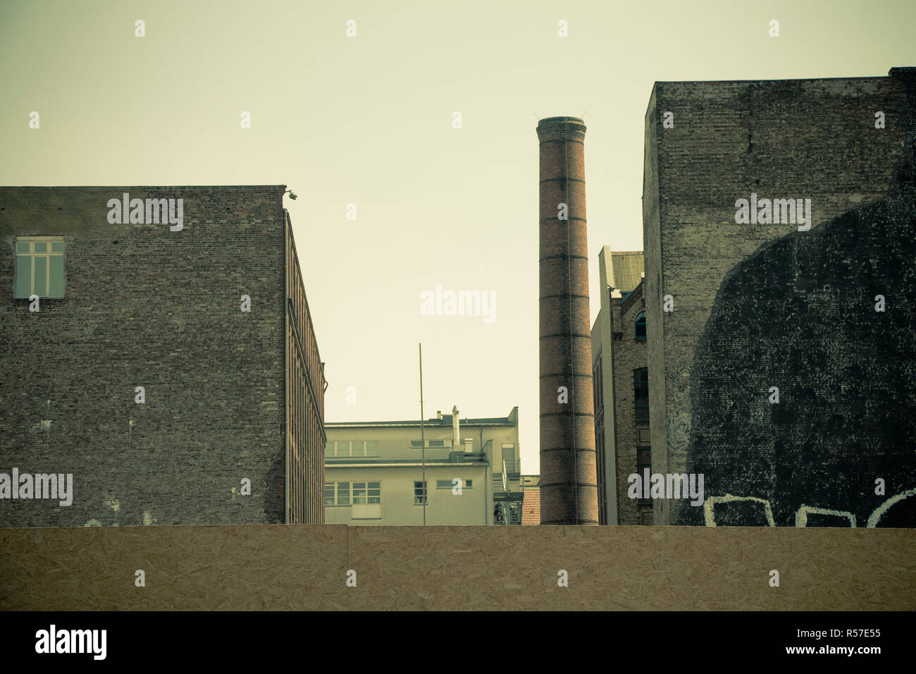 Old factory building with industrial brick chimney Stock Photo - Alamy