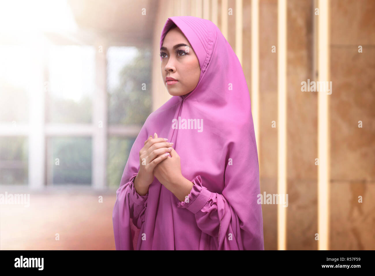 Young asian muslim woman in hijab dress praying Stock Photo - Alamy