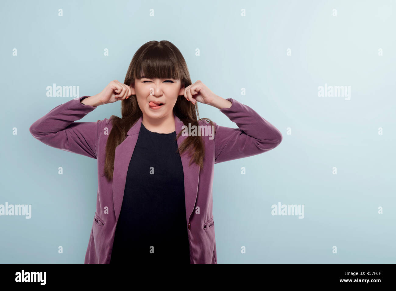 Funny expression asian woman with hand on her Stock Photo - Alamy