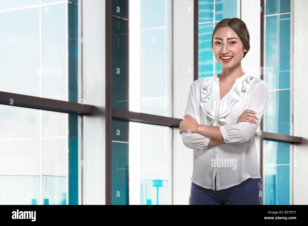 Modern asian business woman with folded arms Stock Photo - Alamy