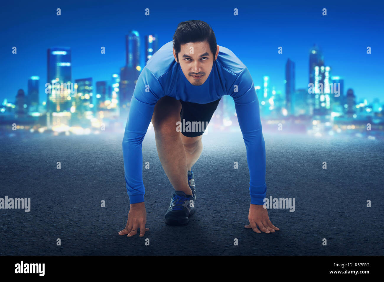 Runner asian man with hands on starting line ready to sprint Stock ...