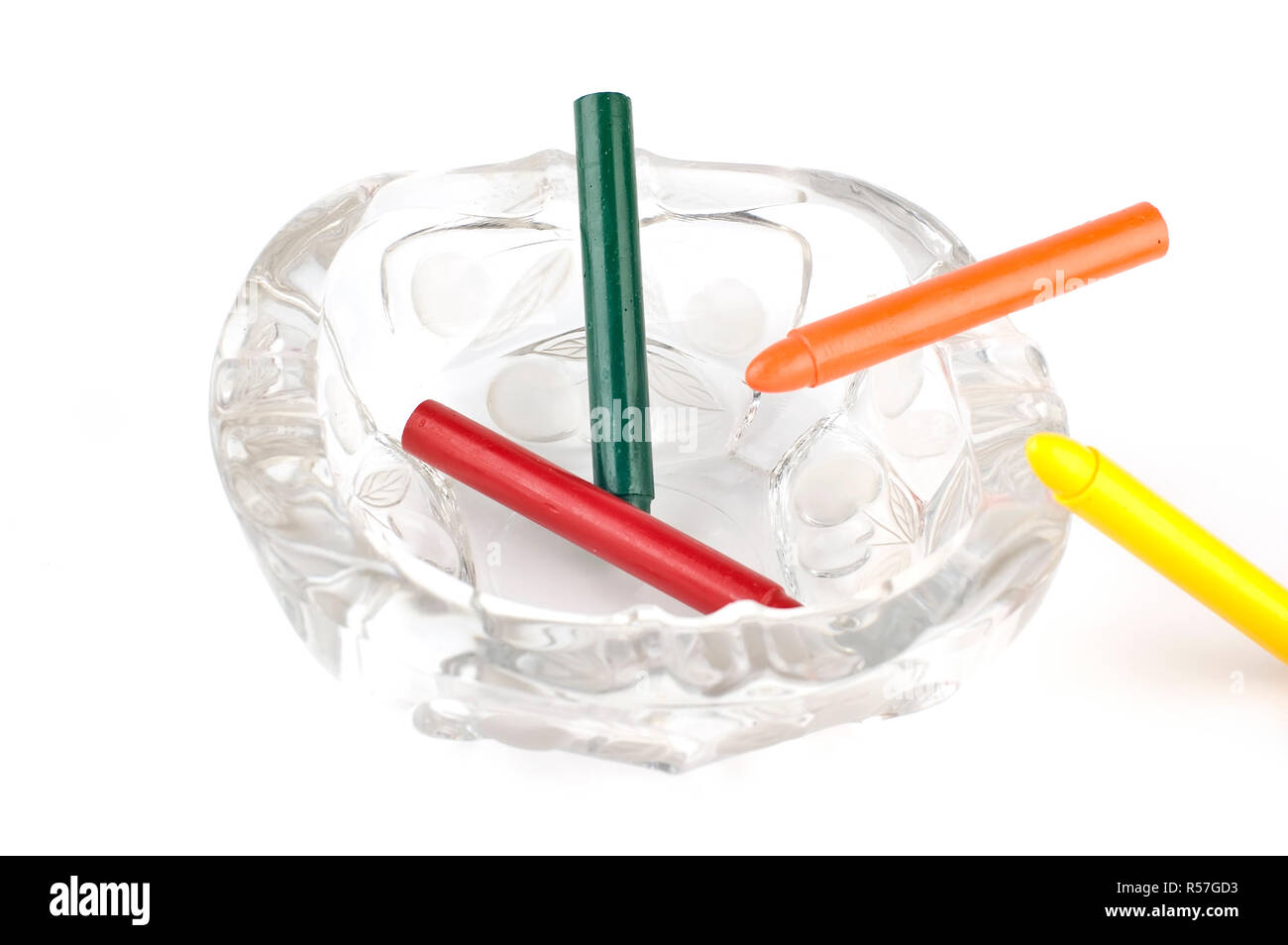 Four Crayons On Ashtray Stock Photo - Alamy