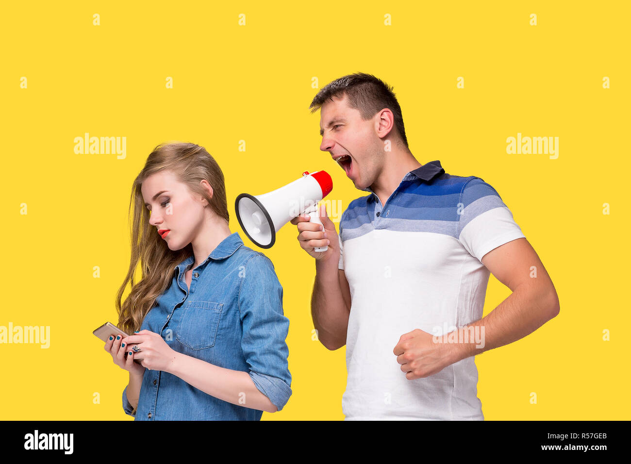 Aggressive businessman shouting megaphone in hi-res stock photography ...