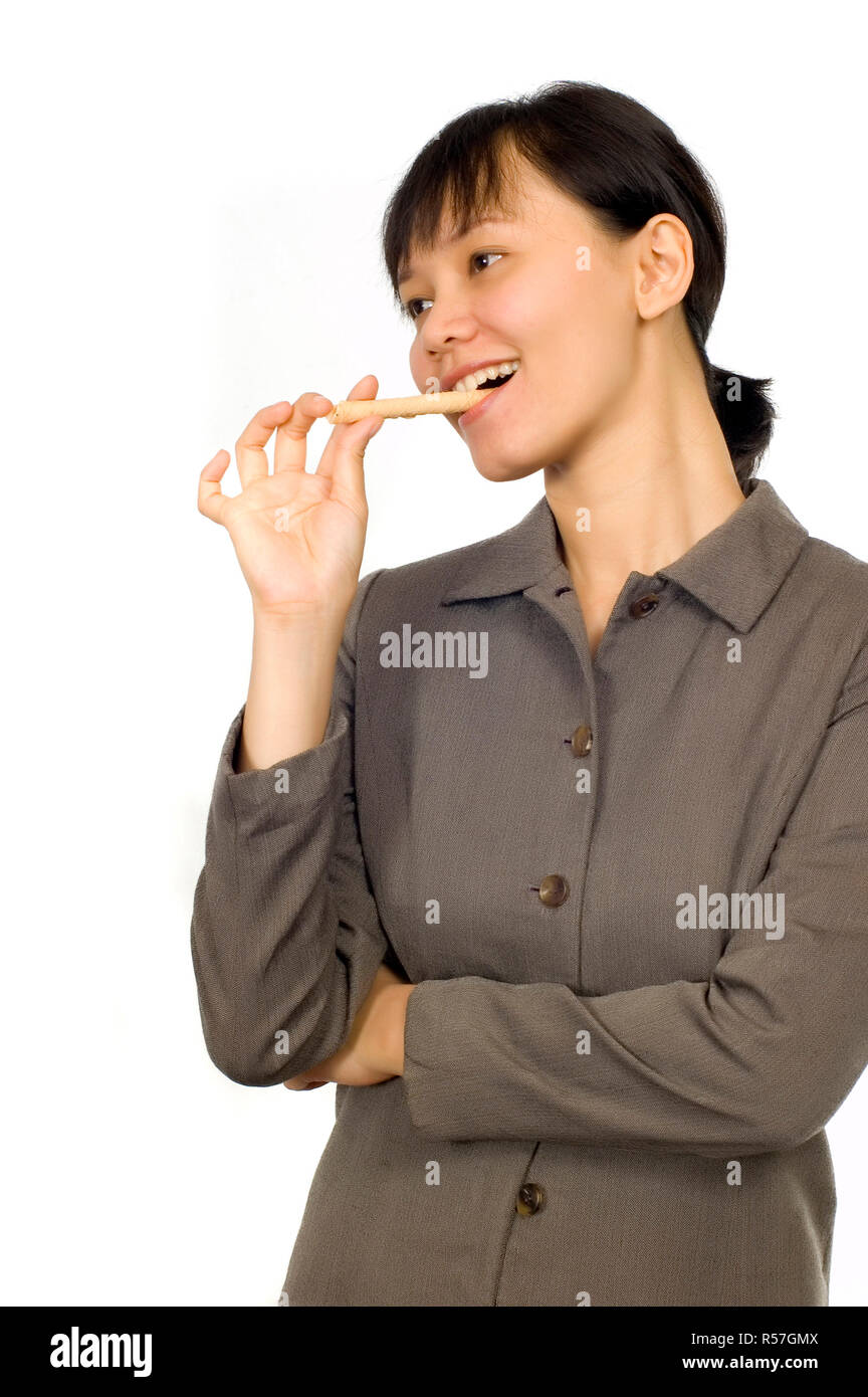Pretty Woman Eating Cookie on White Background Stock Photo - Alamy