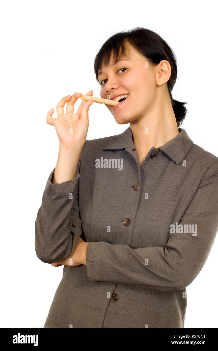 Pretty Woman Eating Cookie on White Background Stock Photo - Alamy