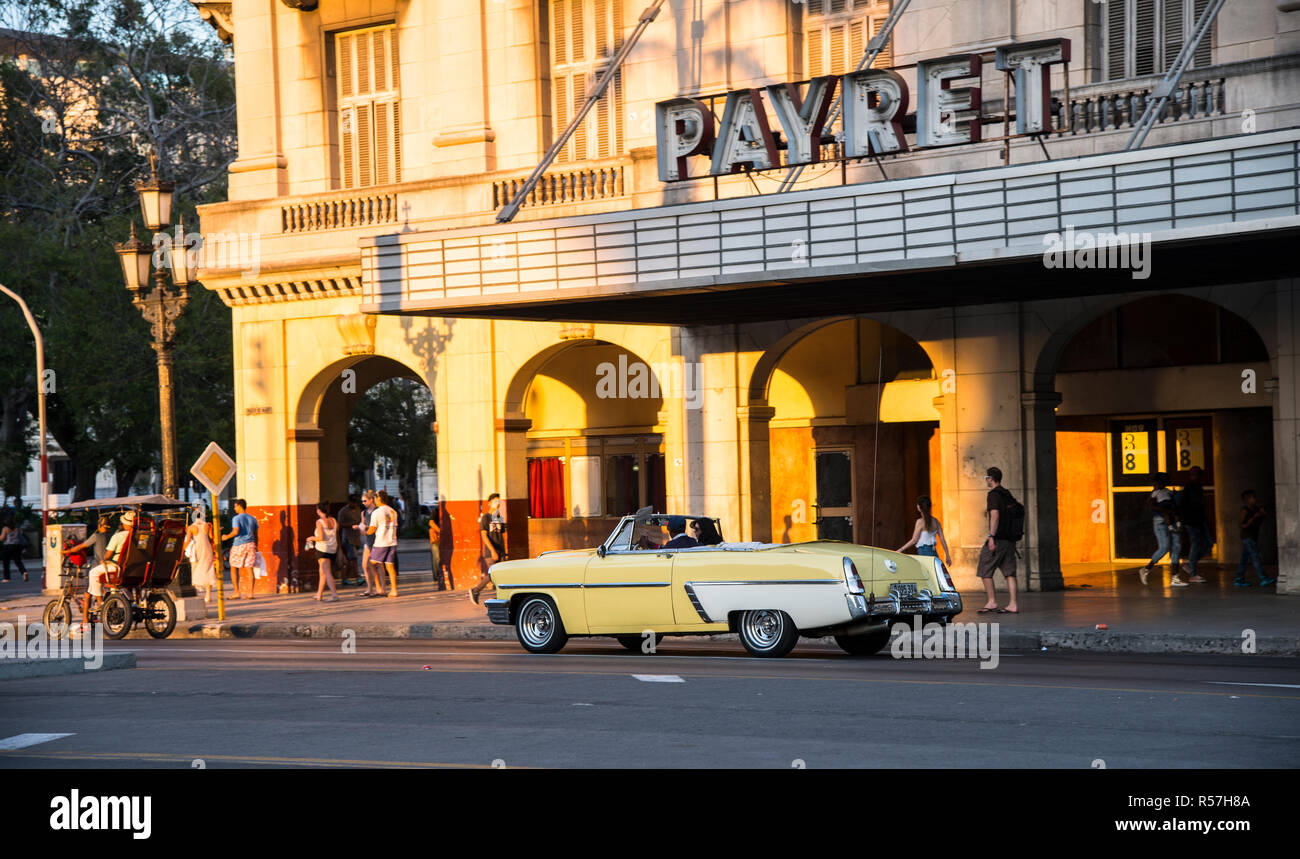 Classic 1950's yellow and white convertible by the Payret Movie Theater ...