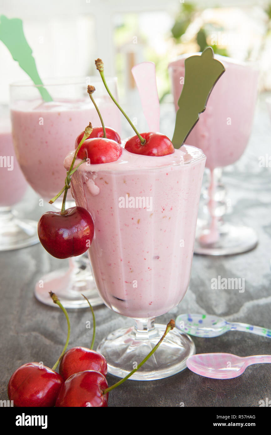 colorful milkshake with cherry Stock Photo - Alamy