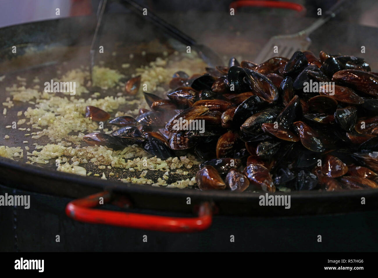 Cooking steamed roasted mussels close up Stock Photo - Alamy