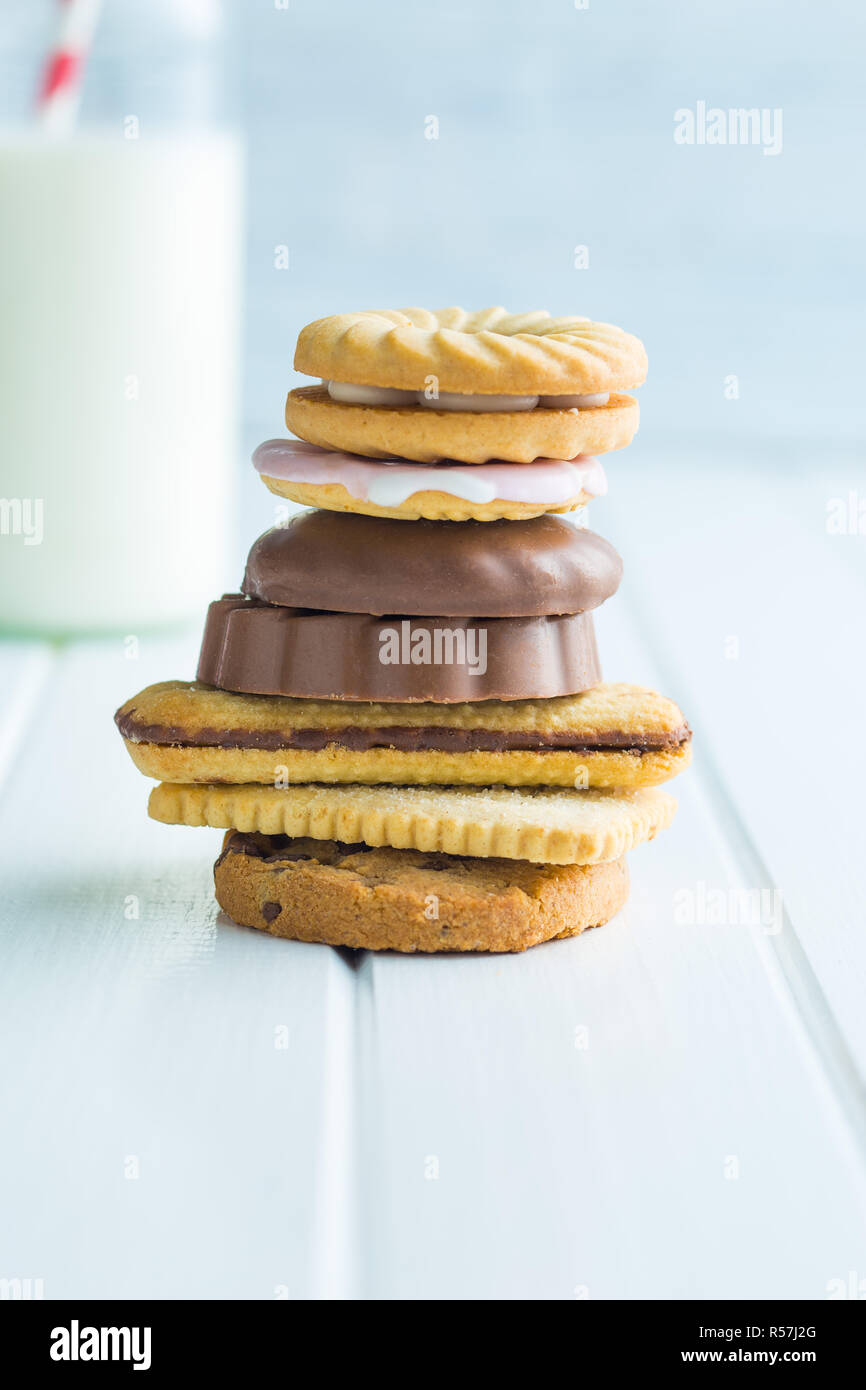 Various sweet biscuits and milk Stock Photo - Alamy