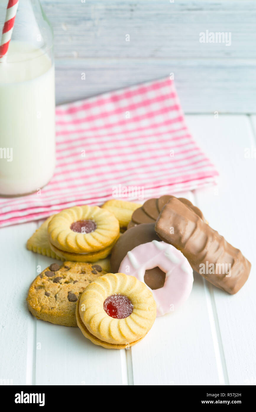 Various sweet biscuits and milk Stock Photo - Alamy