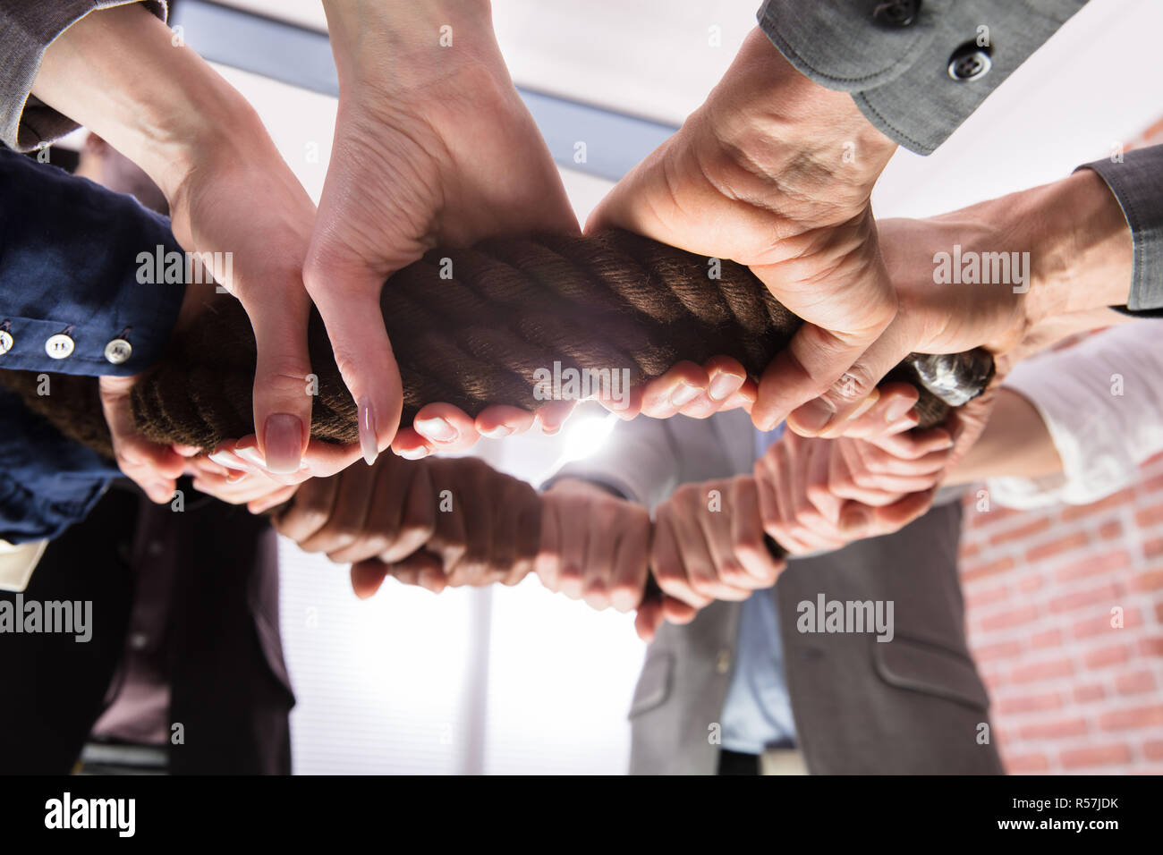 Group people forming help hi-res stock photography and images - Alamy
