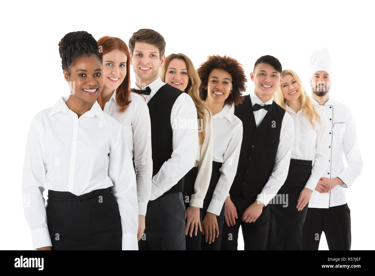 Hotel staff standing together smiling hi-res stock photography and ...