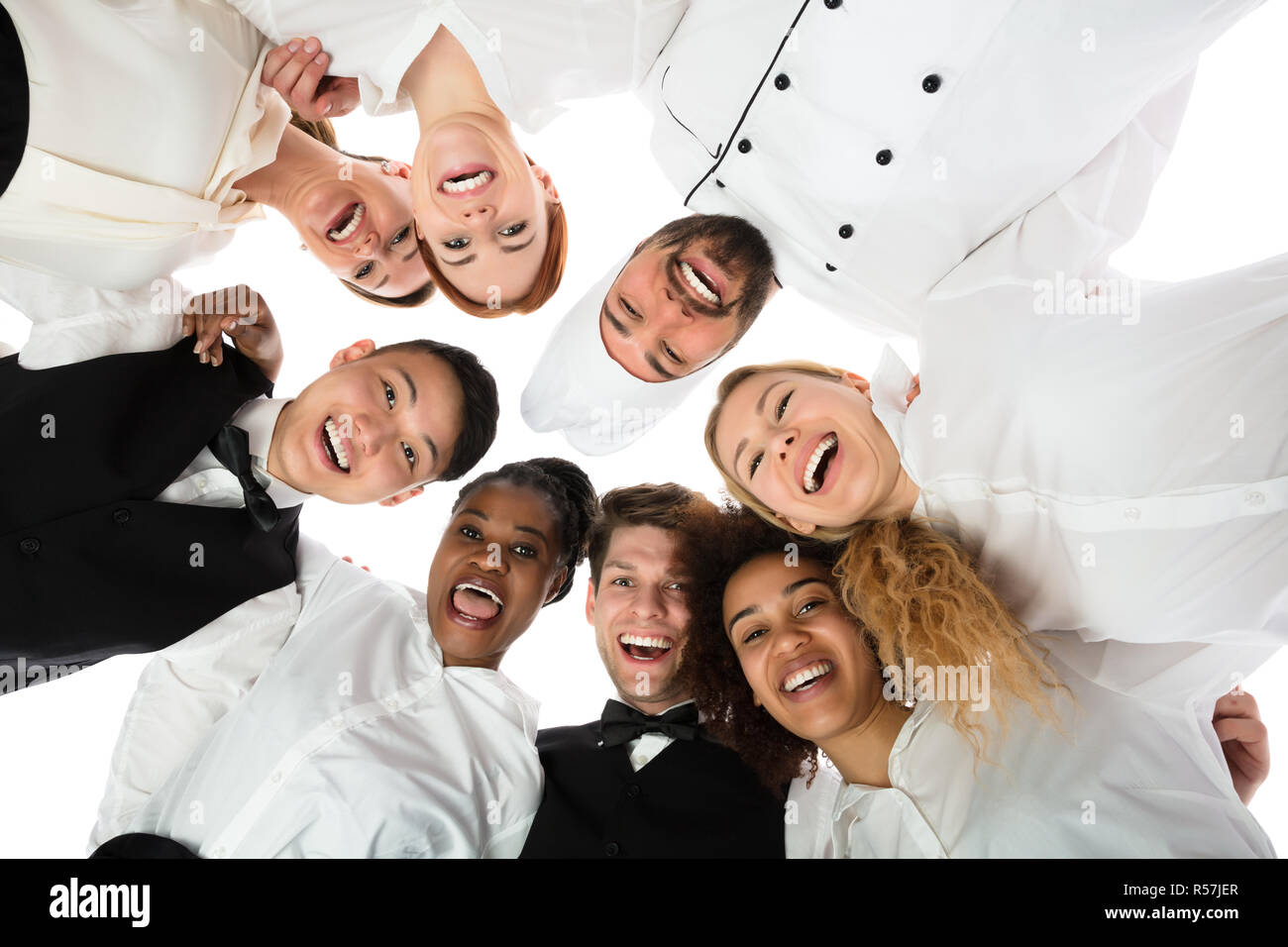 Smiling Restaurant Staff Standing Against White Background Stock Photo ...